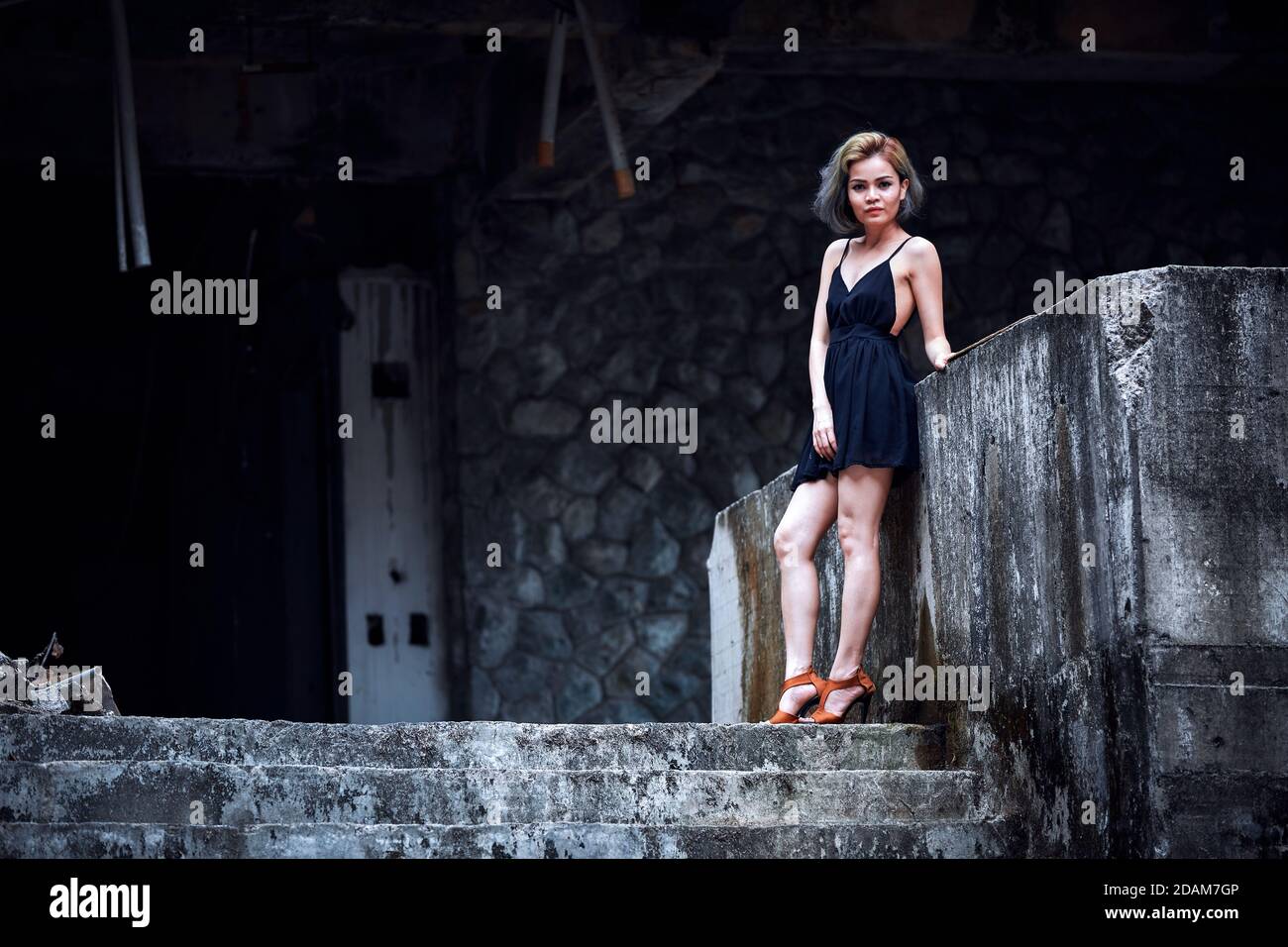Beautiful girl posing on stairs in the abandoned ruined building Stock ...