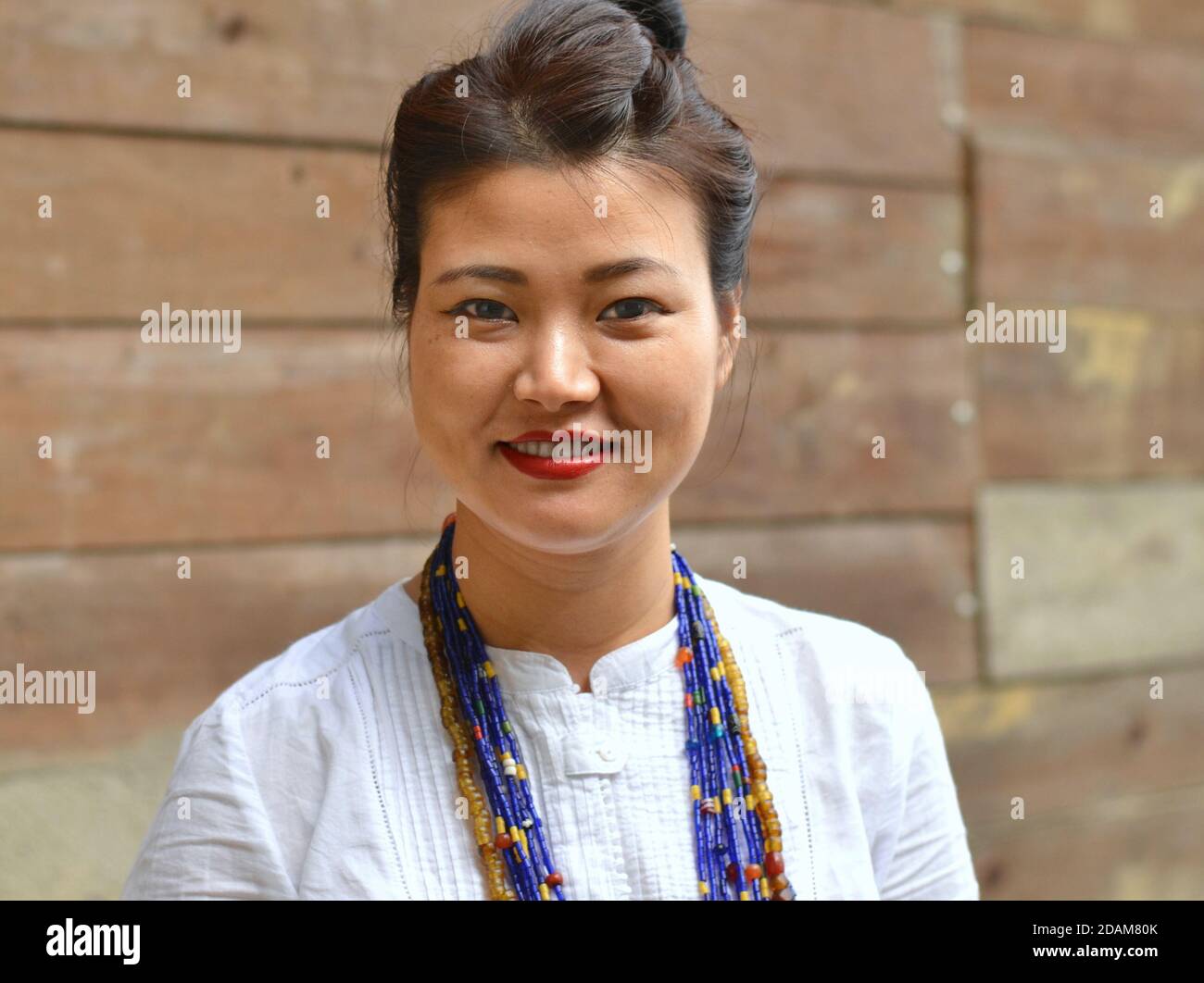 Beautiful modern Indian Apatani tribal woman with red lipstick smiles ...