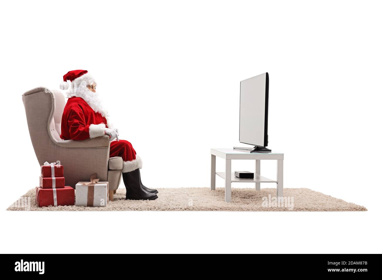 Santa claus watching tv with presents on the floor isolated on white ...