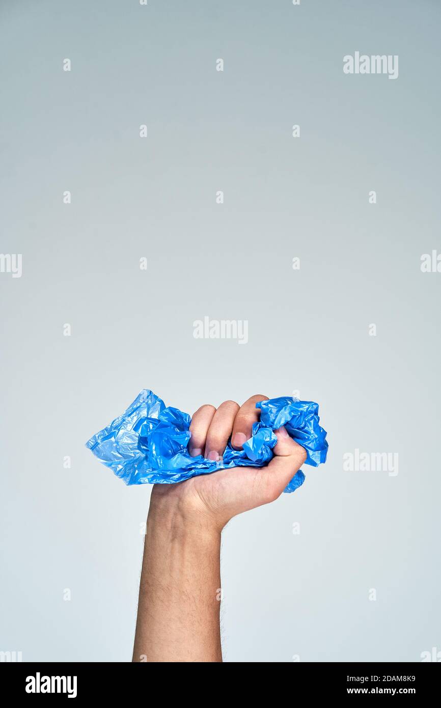 Hand holding a polythene bag. Trash conversion recycle concept Stock ...