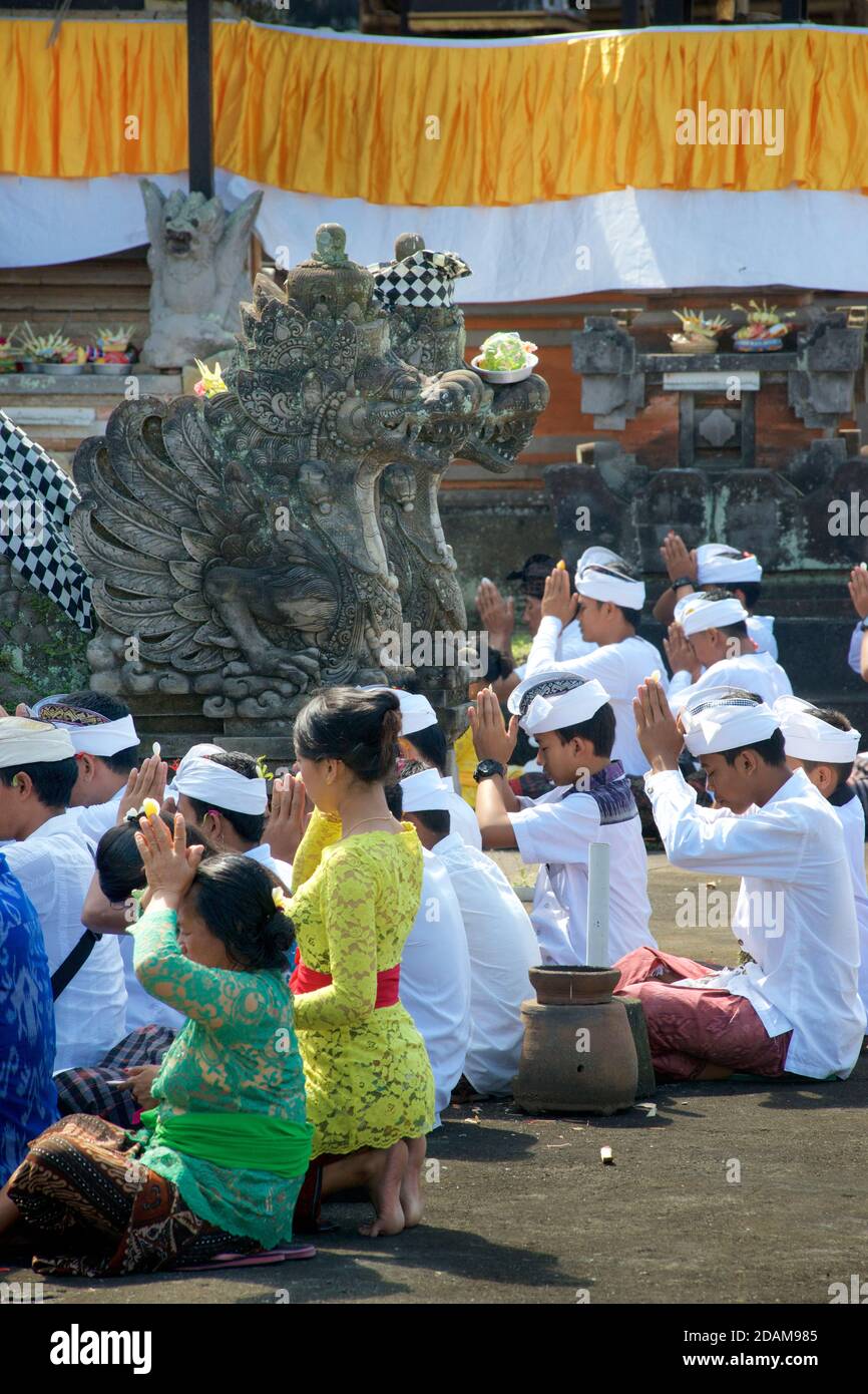 Balinese praying at a temple outside Ubud, Bali for Galungan festival ...