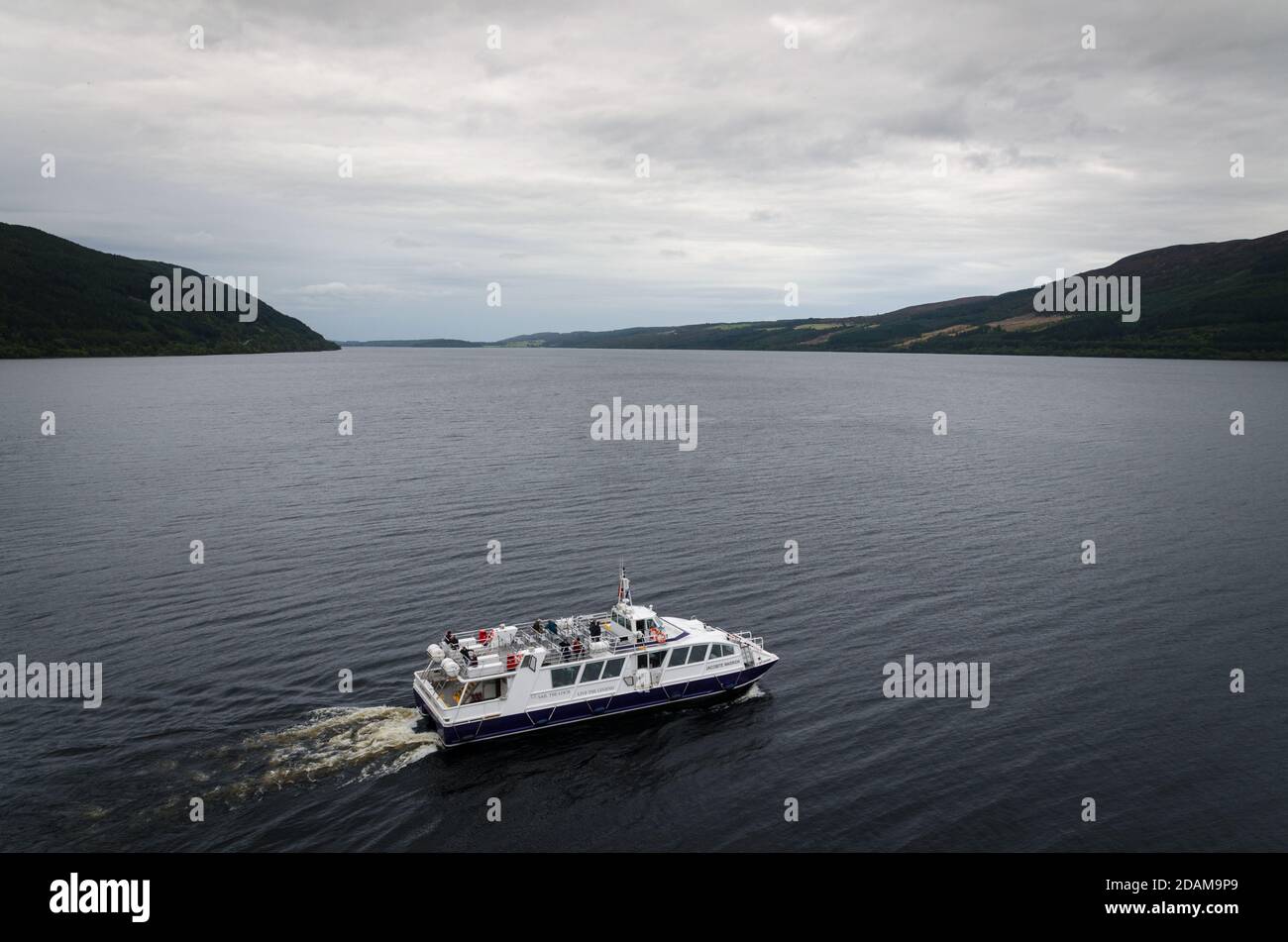 Tourist boat on the famous Loch Ness on a cloudy day, HIghland ...