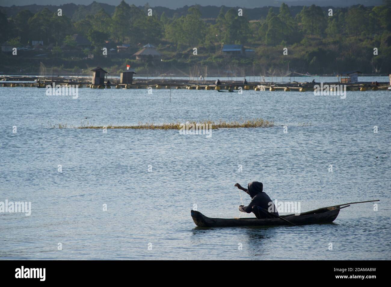 Fishing from a canoe on Lake Batur, BAli, Indonesia Stock Photo - Alamy
