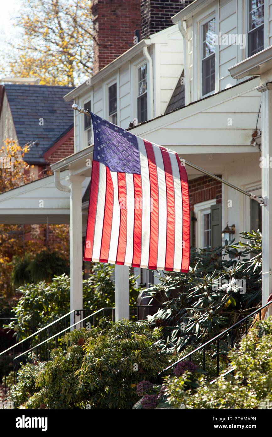 American flag hanging outside house hi-res stock photography and images ...