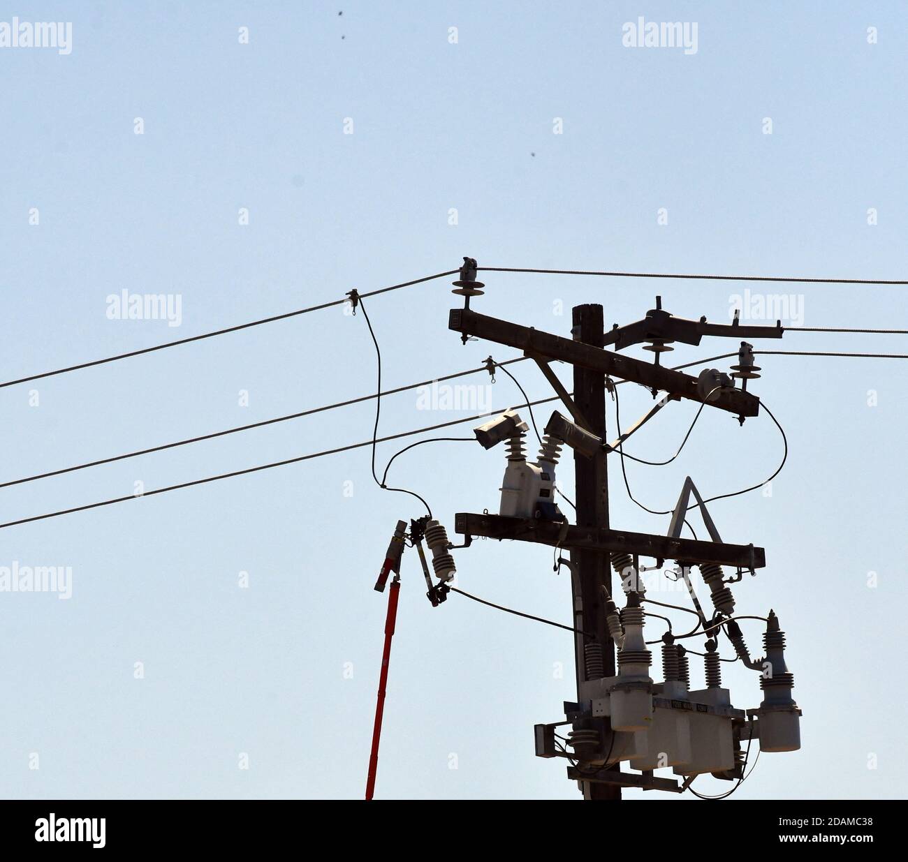 Low angle shot of an electrical power post under the sunlight at ...