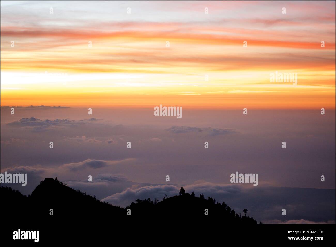 Looking above the clouds, across the Lombok straits, from the crater ...