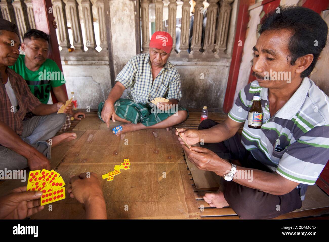 Indonesian men playinga card game, Pringgasela, Lombok, Indonesia Stock ...