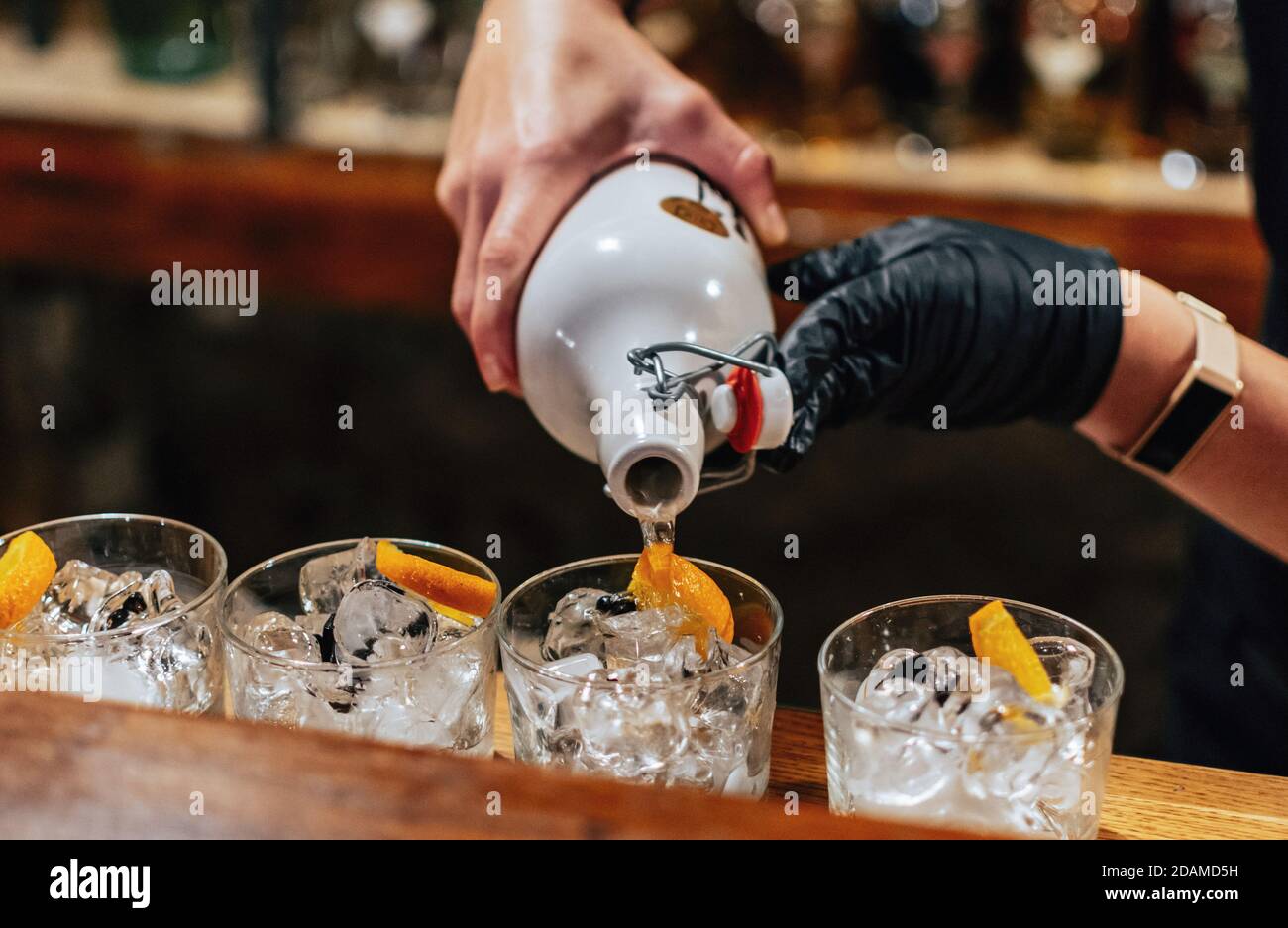 Shot of a bartender making an alcoholic drink Stock Photo - Alamy