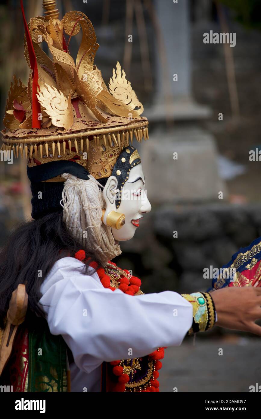 Young Balinese woman in festive dance wear for temple ceremonial dance ...