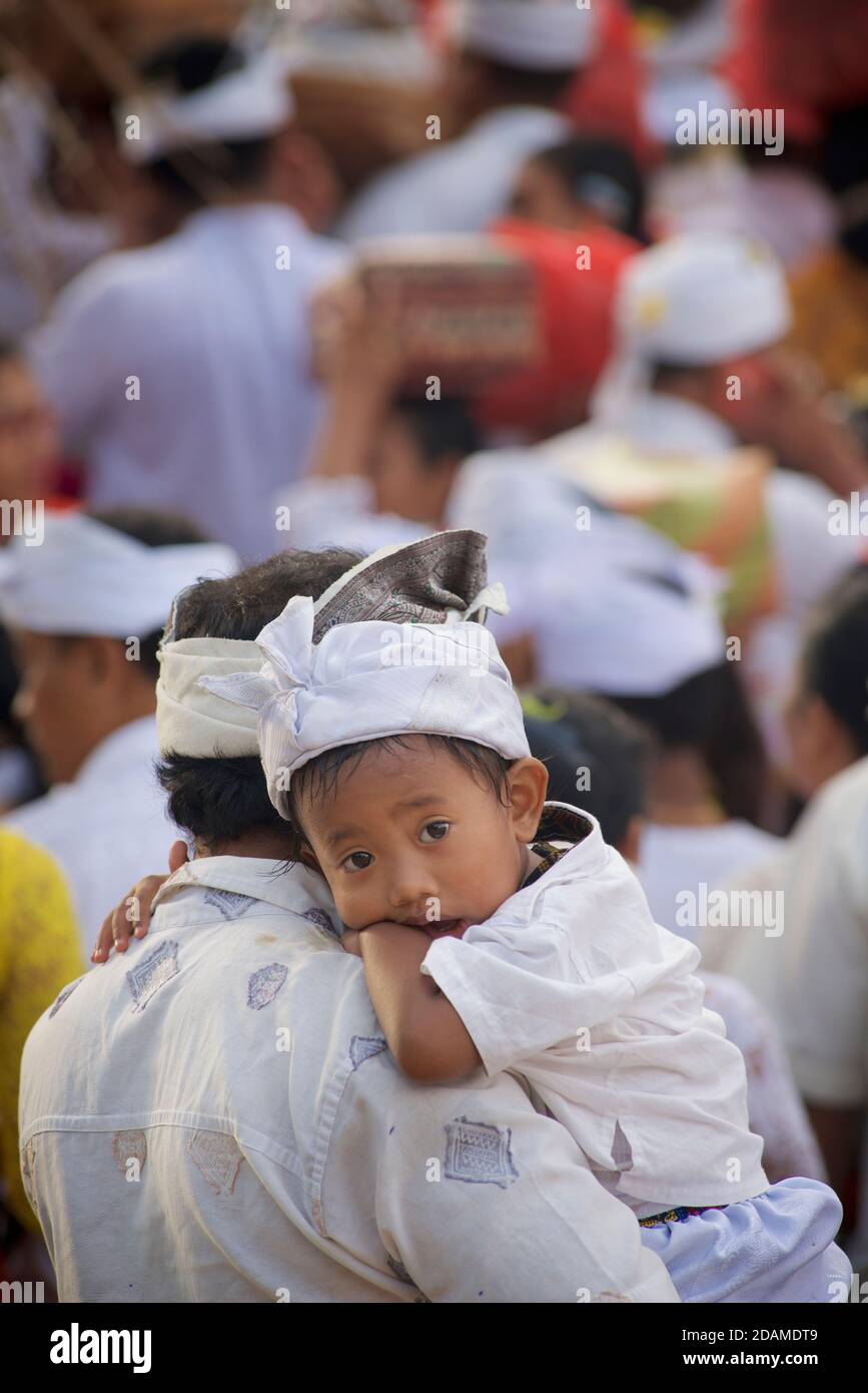Balinese boy in festive attire at at Sakenan temple, Bali, Indonesia ...