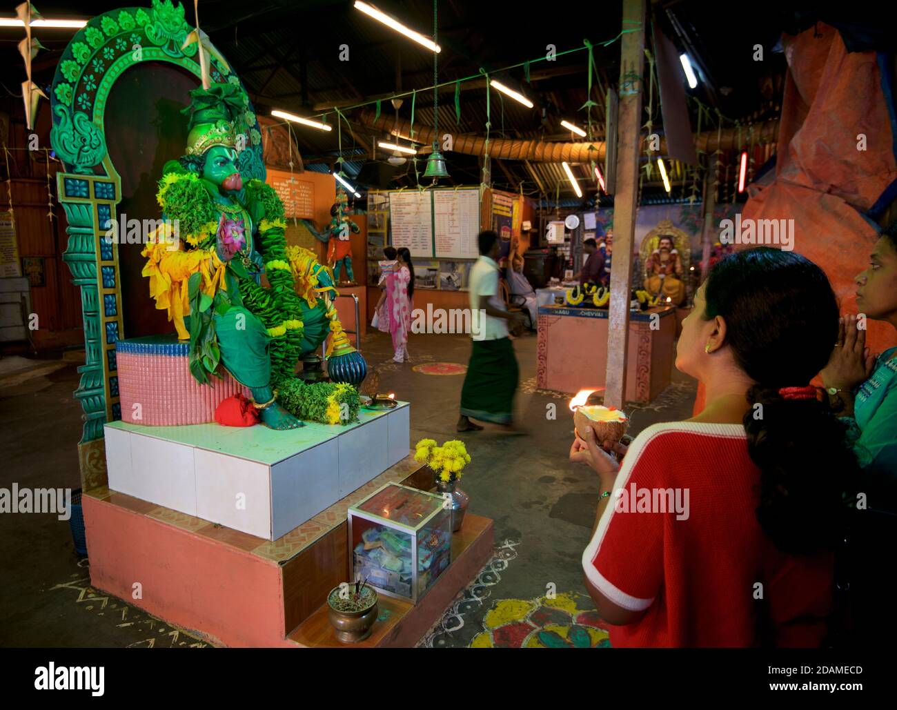 Burning offering to statue of hanuman,monkey god at Arulmigu Sree Veera ...