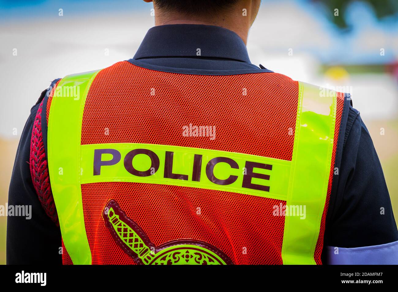 back of a Thai police officer's jacket with the word police written ...