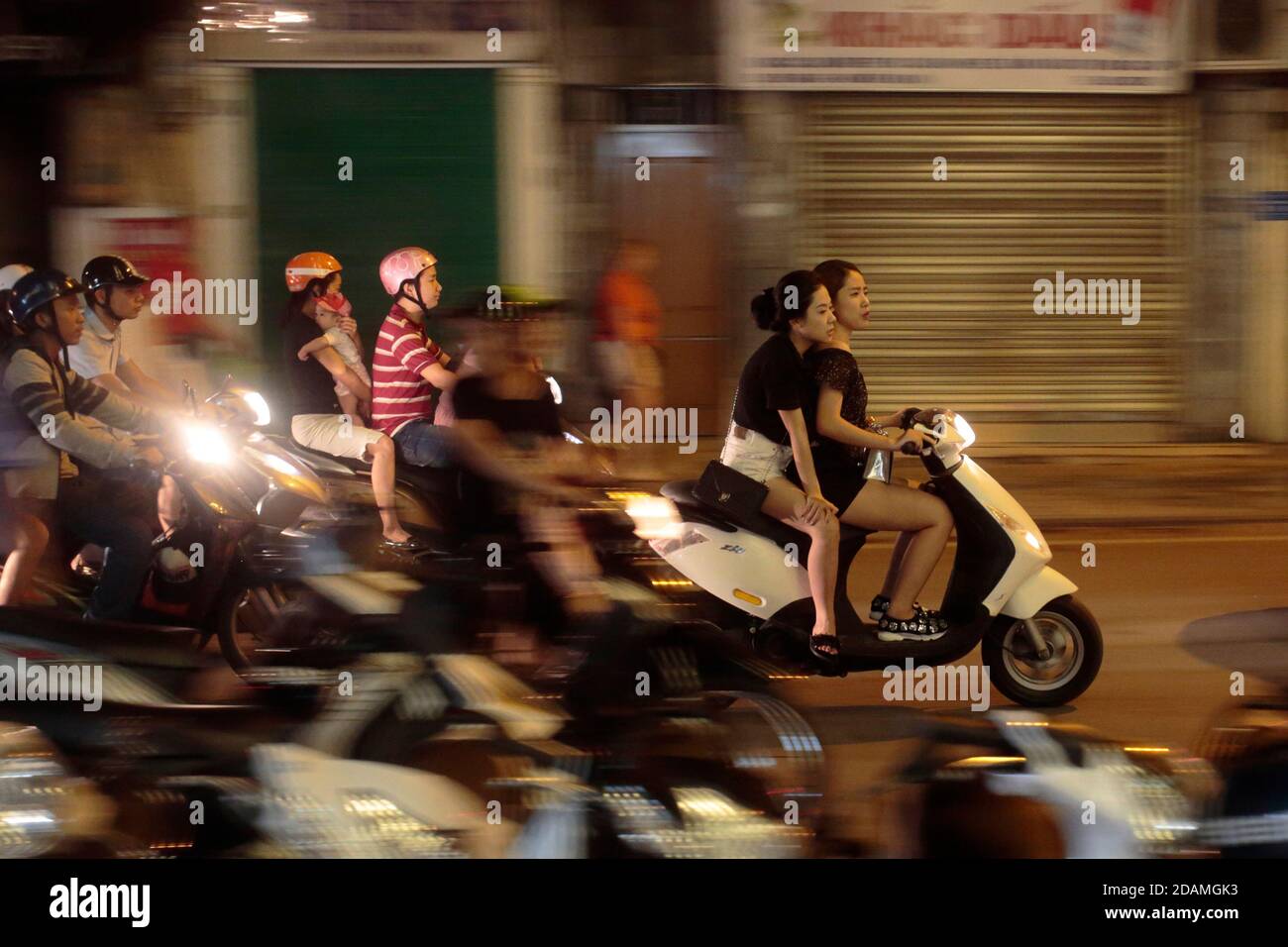Motor scooter riders hi-res stock photography and images - Alamy