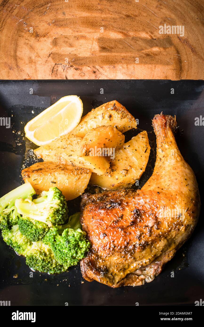 chicken lemonato greak style with vegetables and potato Stock Photo - Alamy