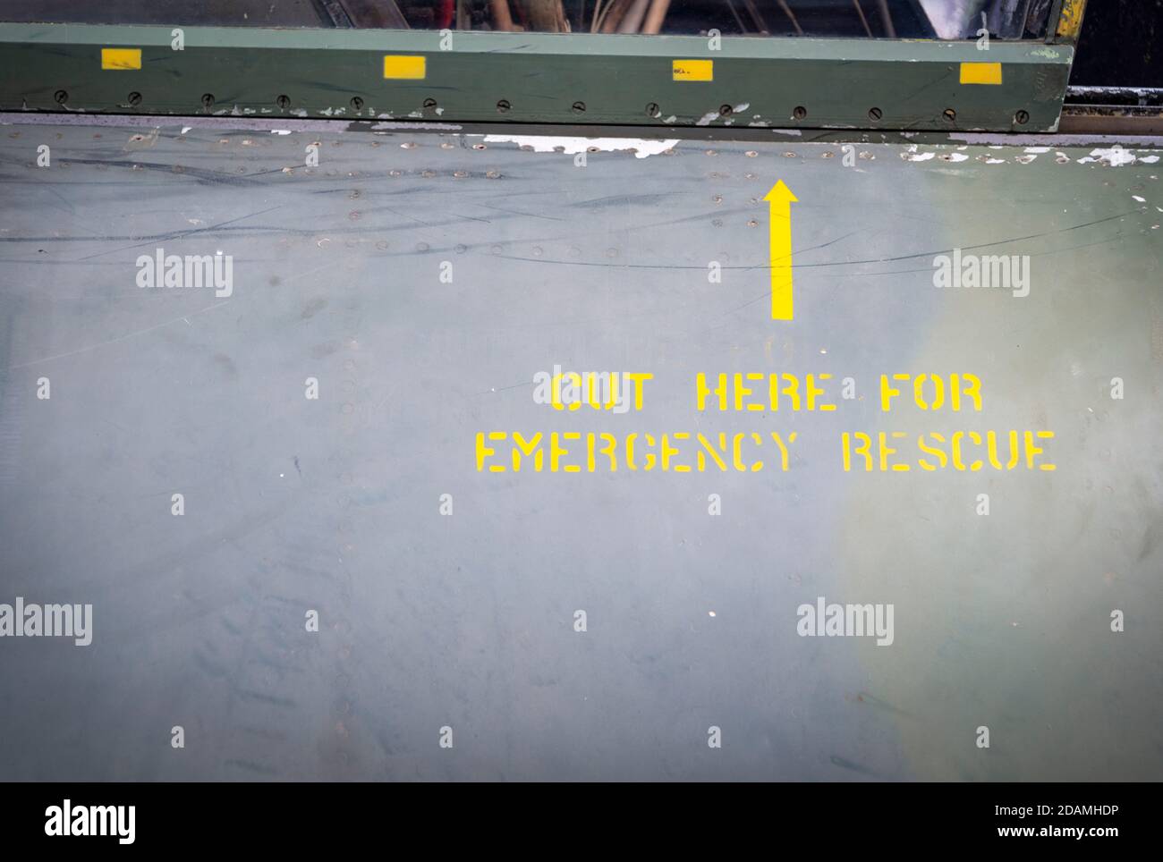 A vintage cockpit with saftey warning signs on the side, Cut Here For ...
