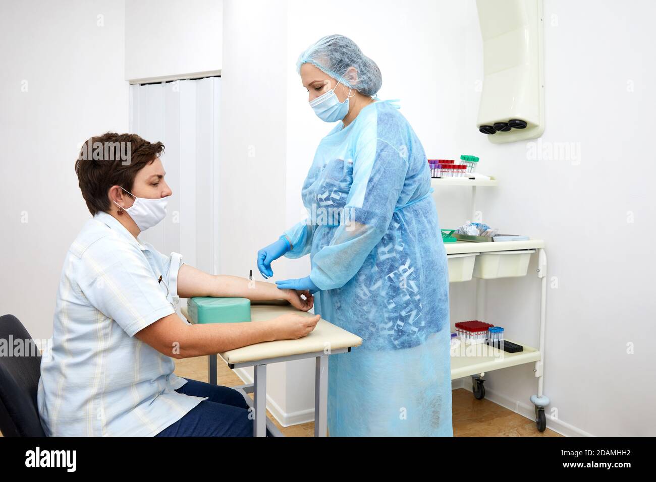 Nurse taking blood sample to make a test in laboratory Stock Photo - Alamy