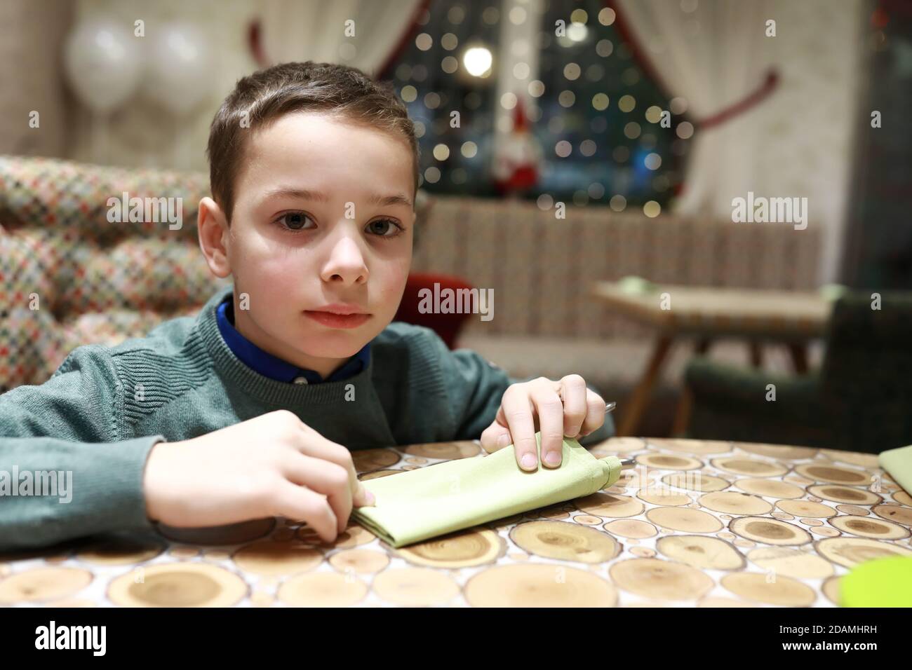 Bored kid at dinner table hi-res stock photography and images - Alamy