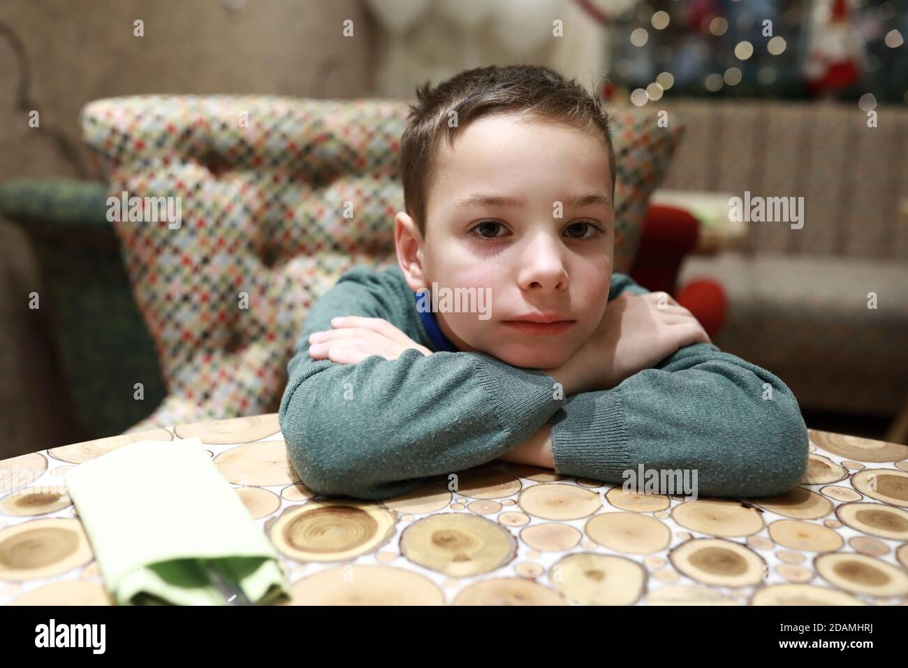 Bored kid at dinner table hi-res stock photography and images - Alamy