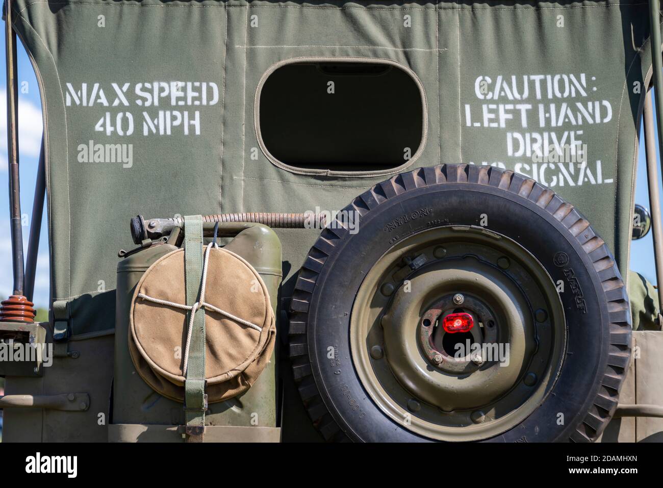 Old army vehicle, military green, with a left hand drive caution and a ...