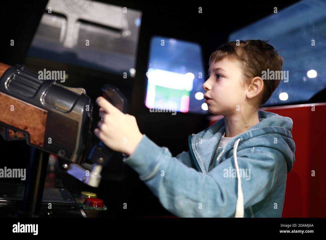 Boy with toy machine gun hi-res stock photography and images - Alamy