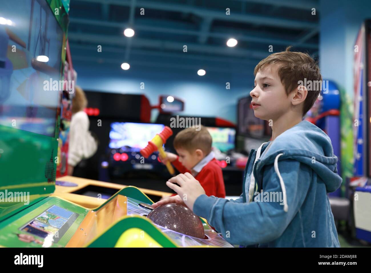 Children playing arcade game in hi-res stock photography and images - Alamy