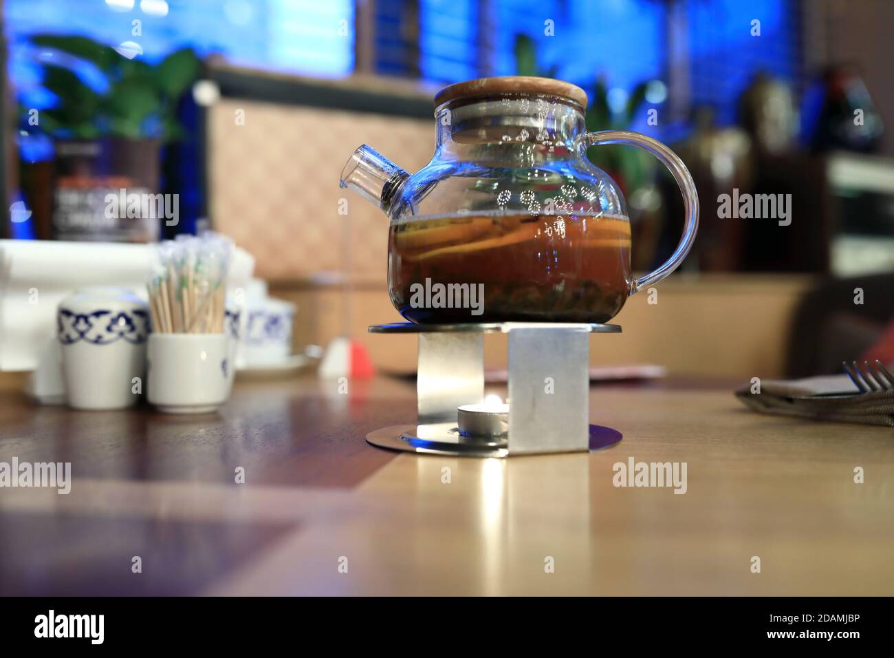 Glass teapot with hot tea in restaurant Stock Photo - Alamy