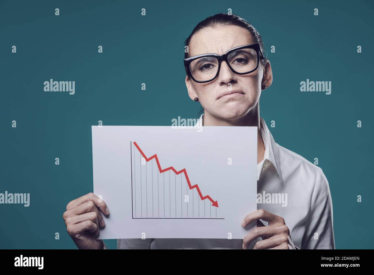 Businesswoman holding a negative financial chart, financial crisis and ...