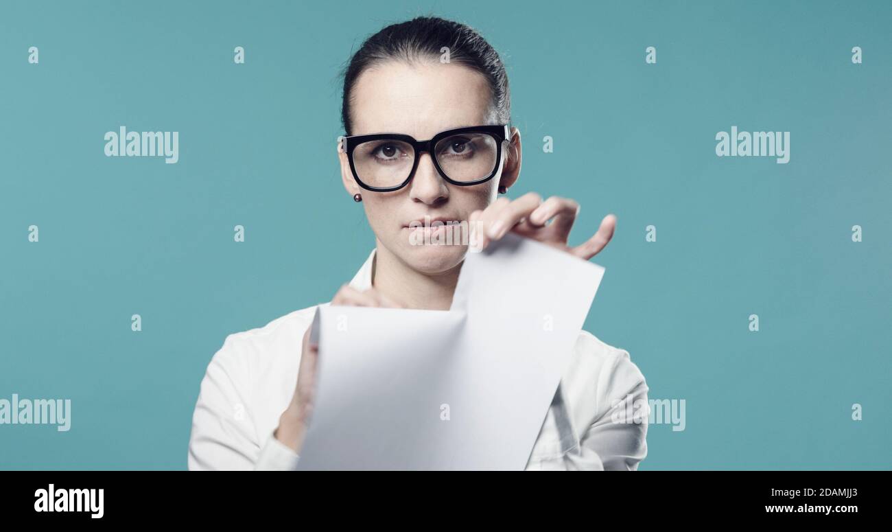Woman ripping up paper hi-res stock photography and images - Alamy