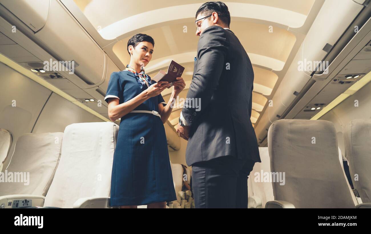 Flight attendant greeting passenger hi-res stock photography and images ...