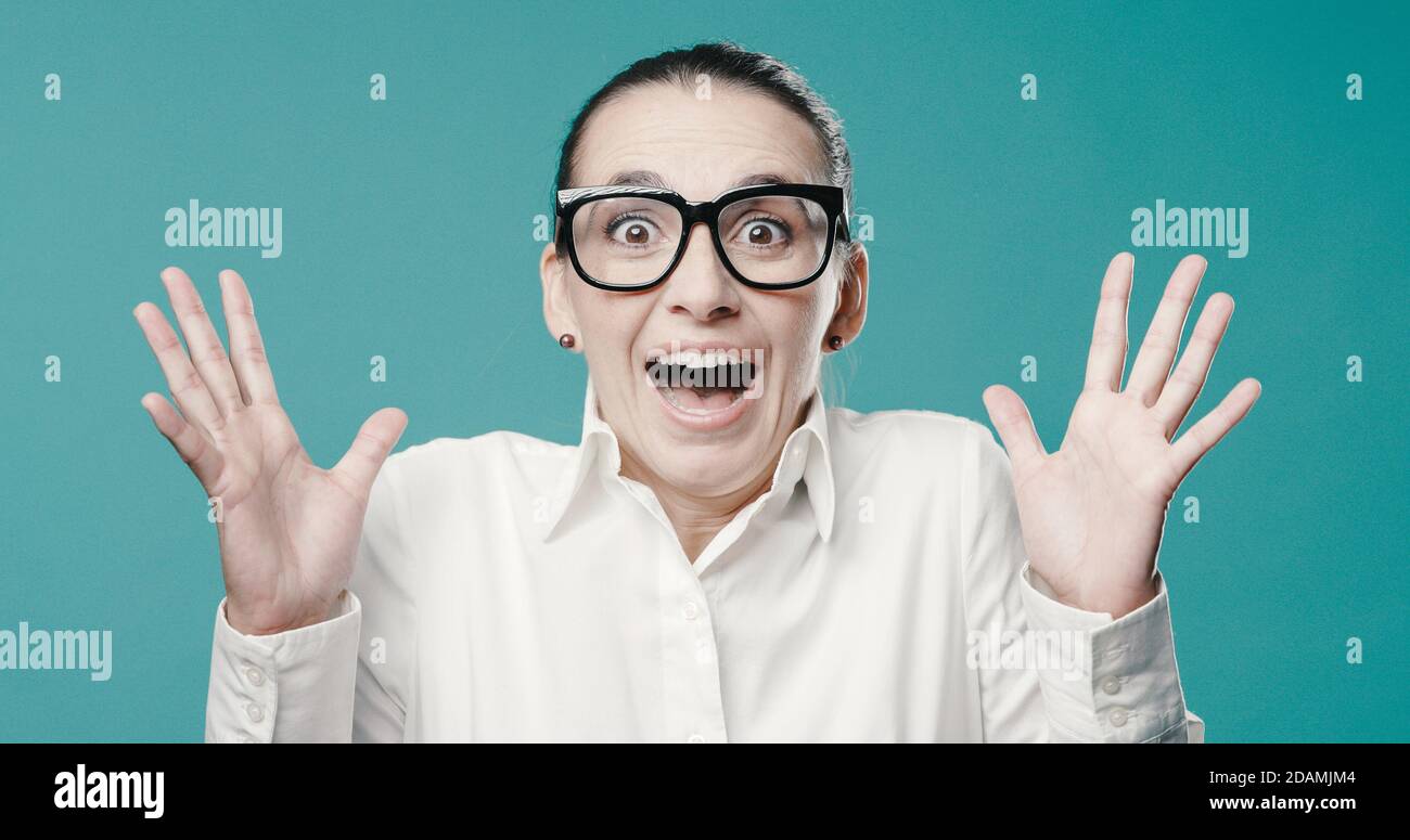 Shocked scared woman screaming and looking at camera, she has made a ...