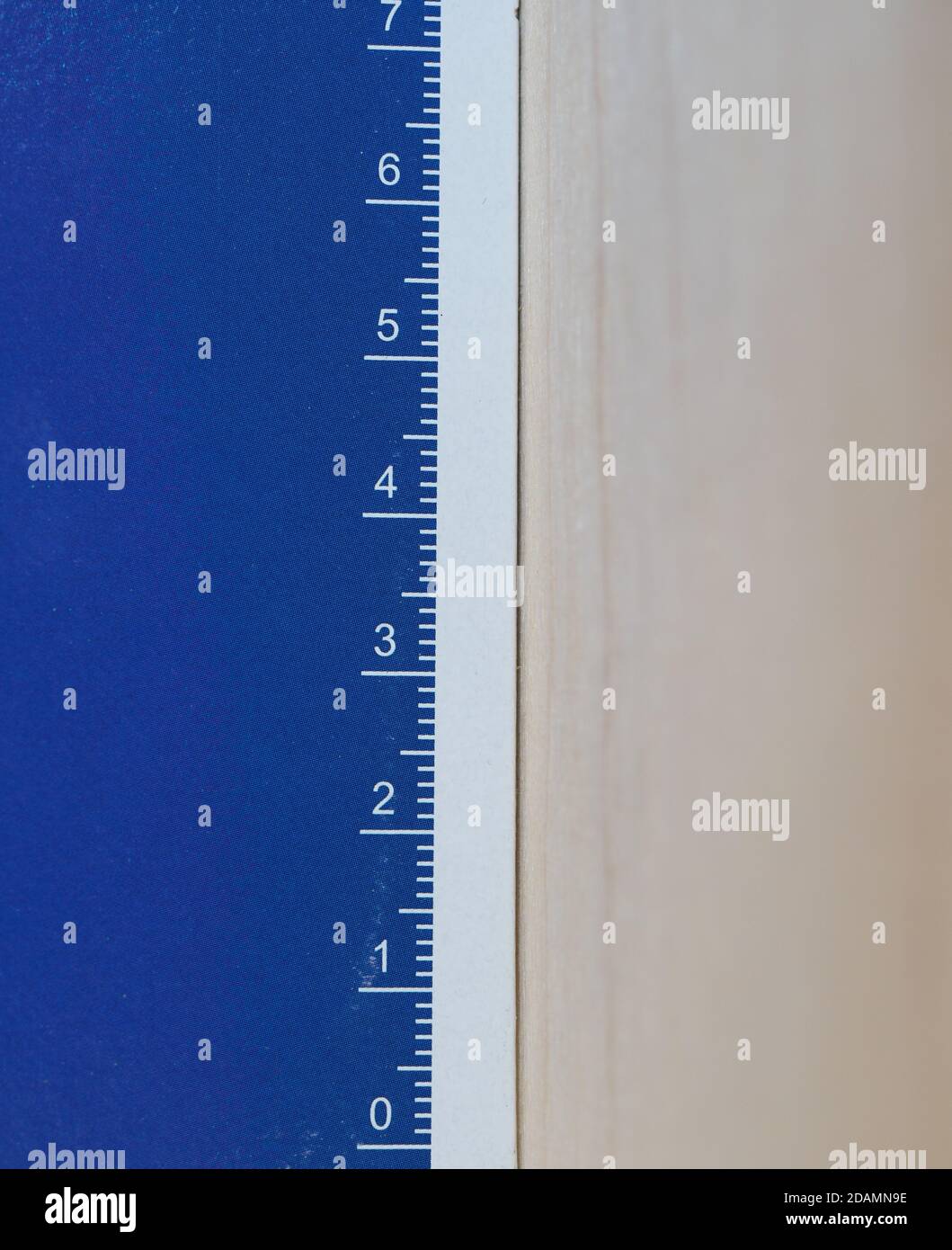 paper ruler with metric units in white over blue Stock Photo - Alamy
