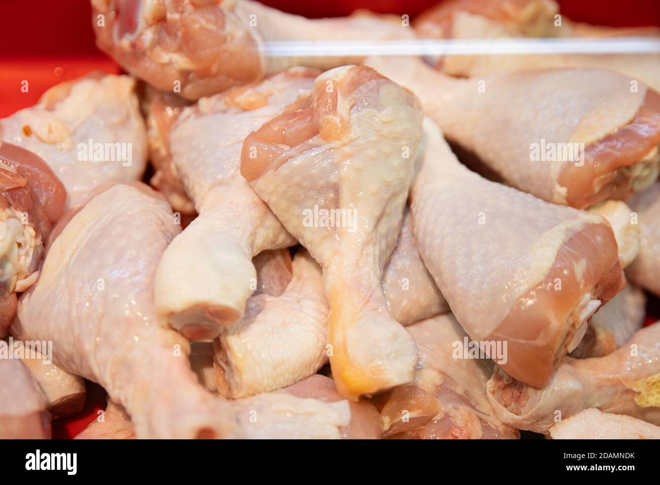 Fresh chicken legs for sale Stock Photo - Alamy