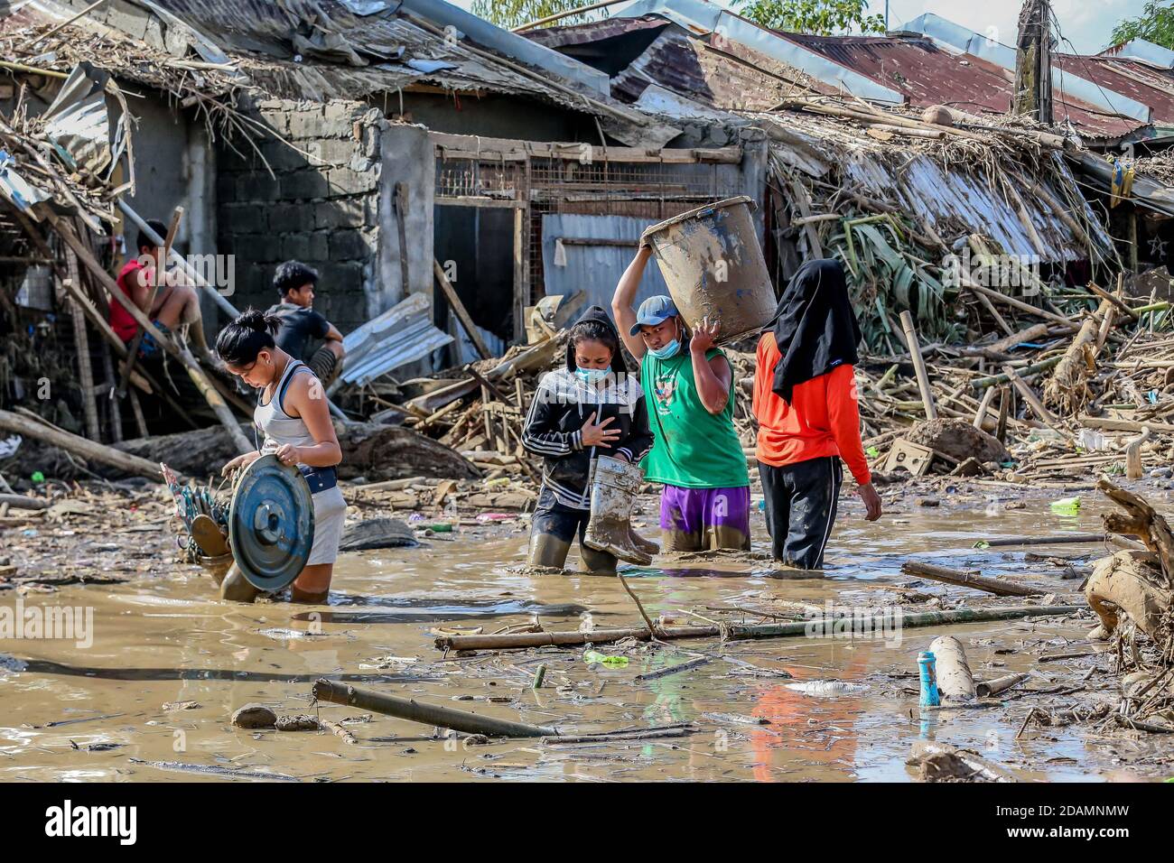 Rizal Province, Philippines. 14th Nov, 2020. Residents walk in knee ...