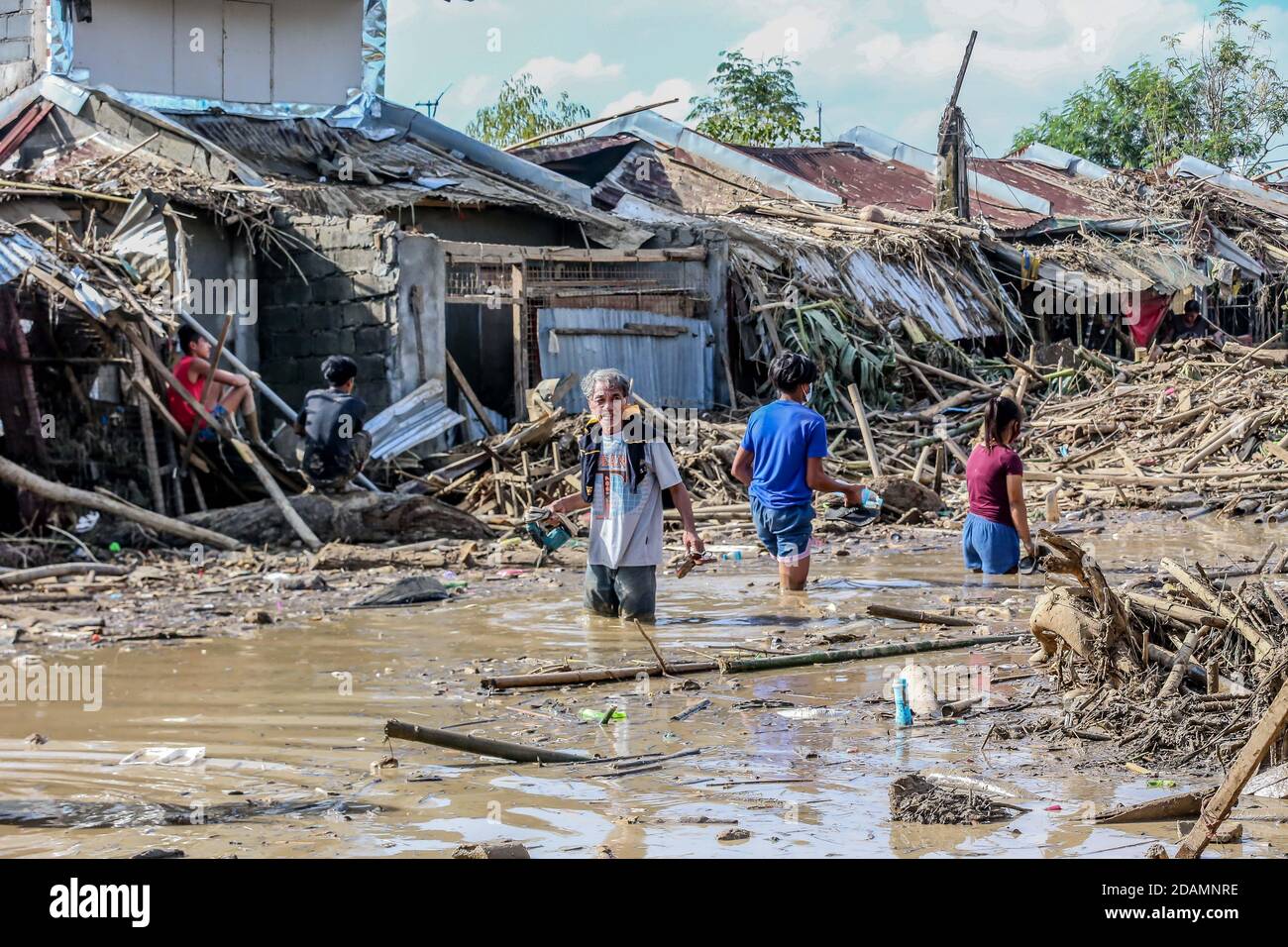 Rizal Province, Philippines. 14th Nov, 2020. Residents walk in knee ...