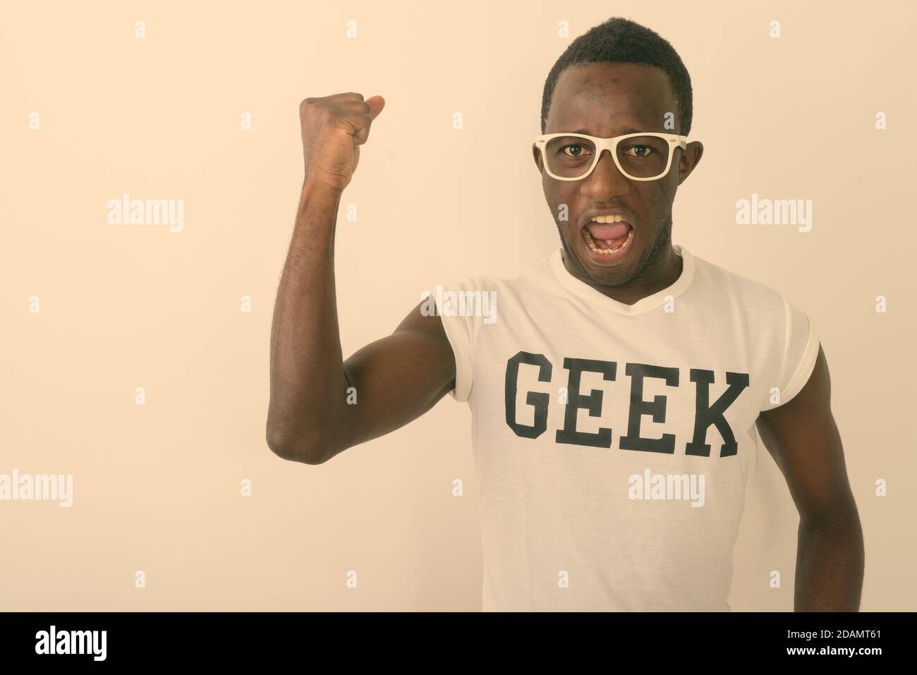 Nerdy man flexing his bicep hi-res stock photography and images - Alamy