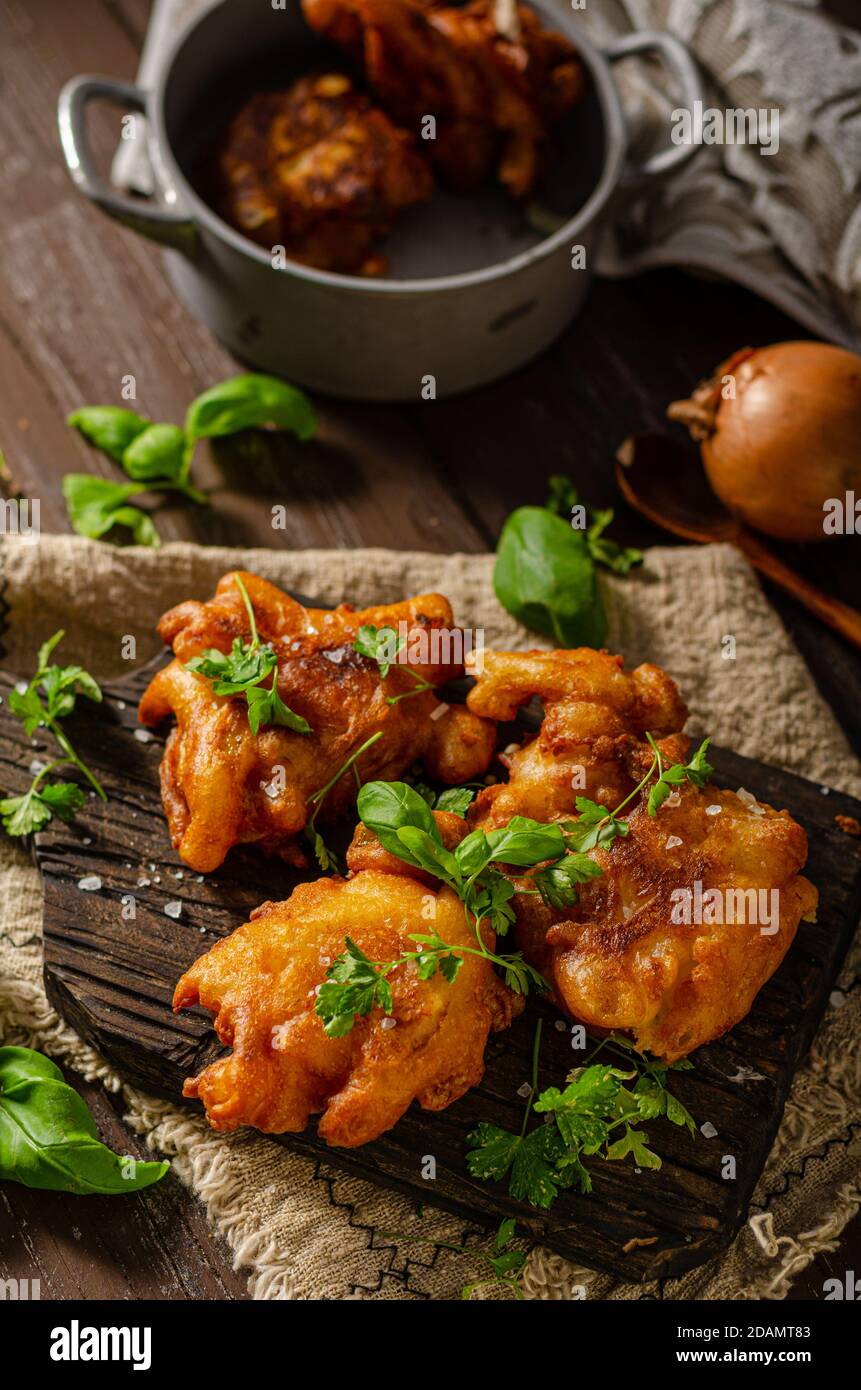 Cheap and crispy food from onion with chilli Stock Photo - Alamy