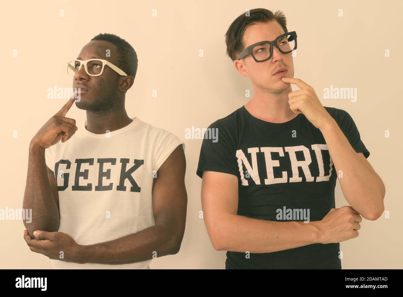 Studio shot of young thoughtful black African Geek man with European ...
