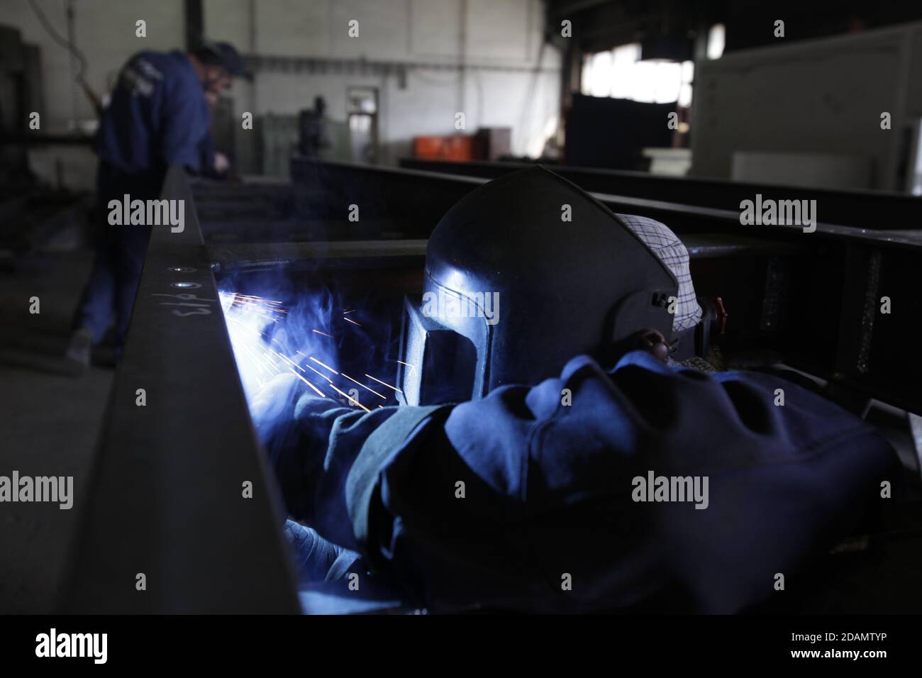 Factory workers in Bosnian factory Stock Photo - Alamy