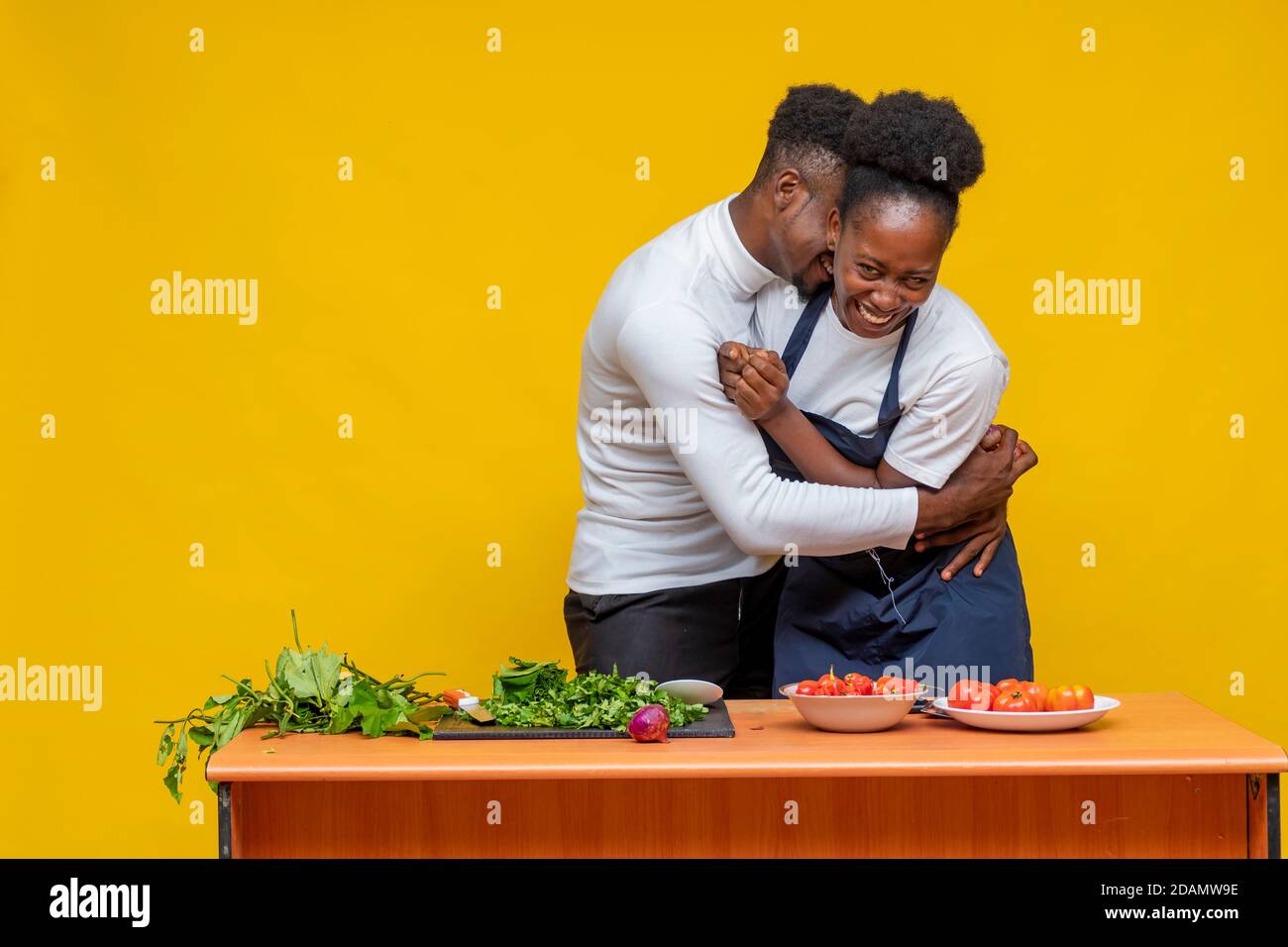 african couple cooking together playfully and having a laugh Stock ...