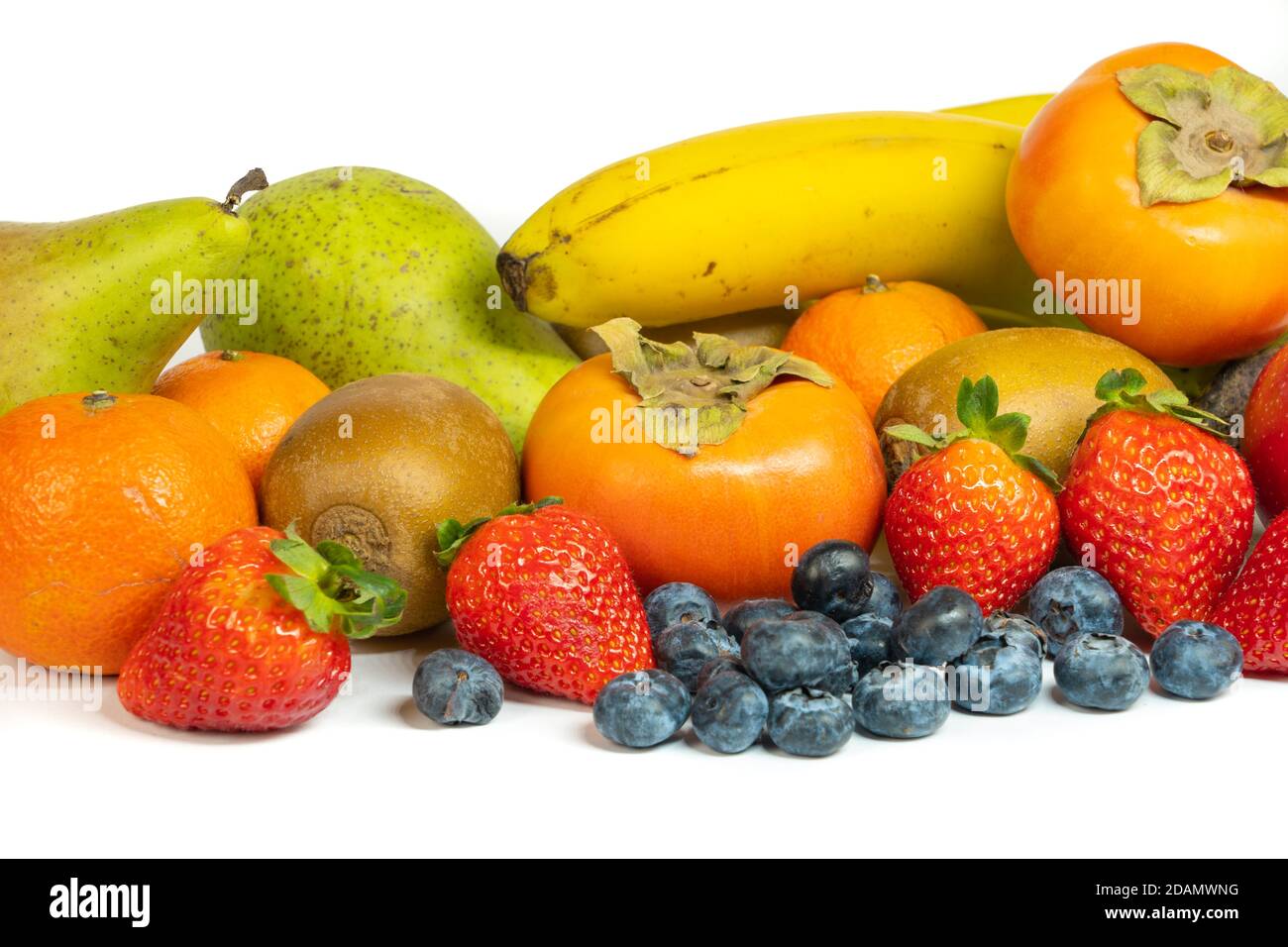 Closeup of various fresh and tasty fruits on a white background Stock ...