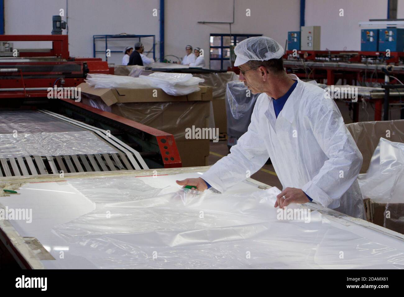 workers in factory Stock Photo - Alamy