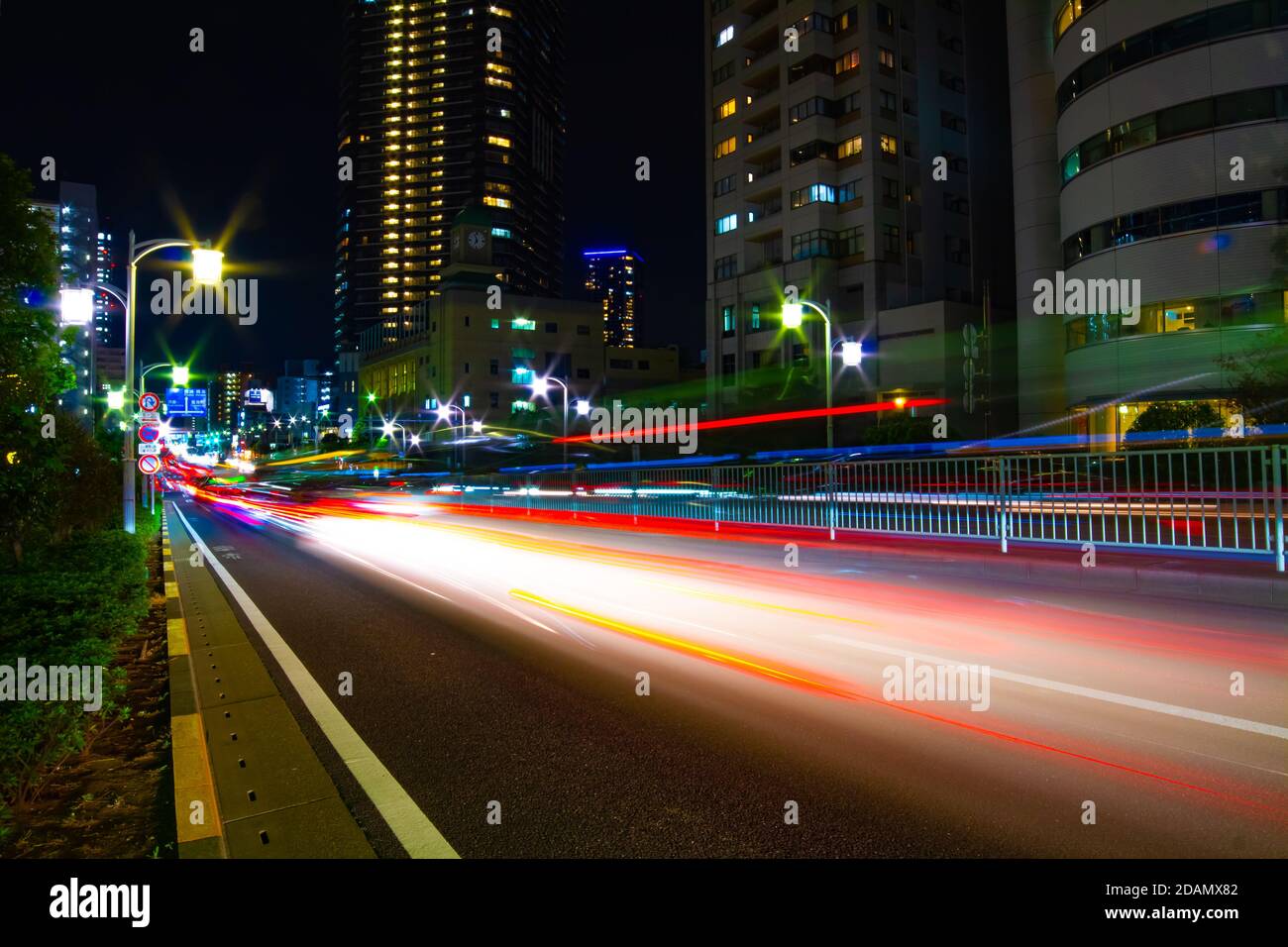 A night city street in Tokyo wide shot Stock Photo - Alamy