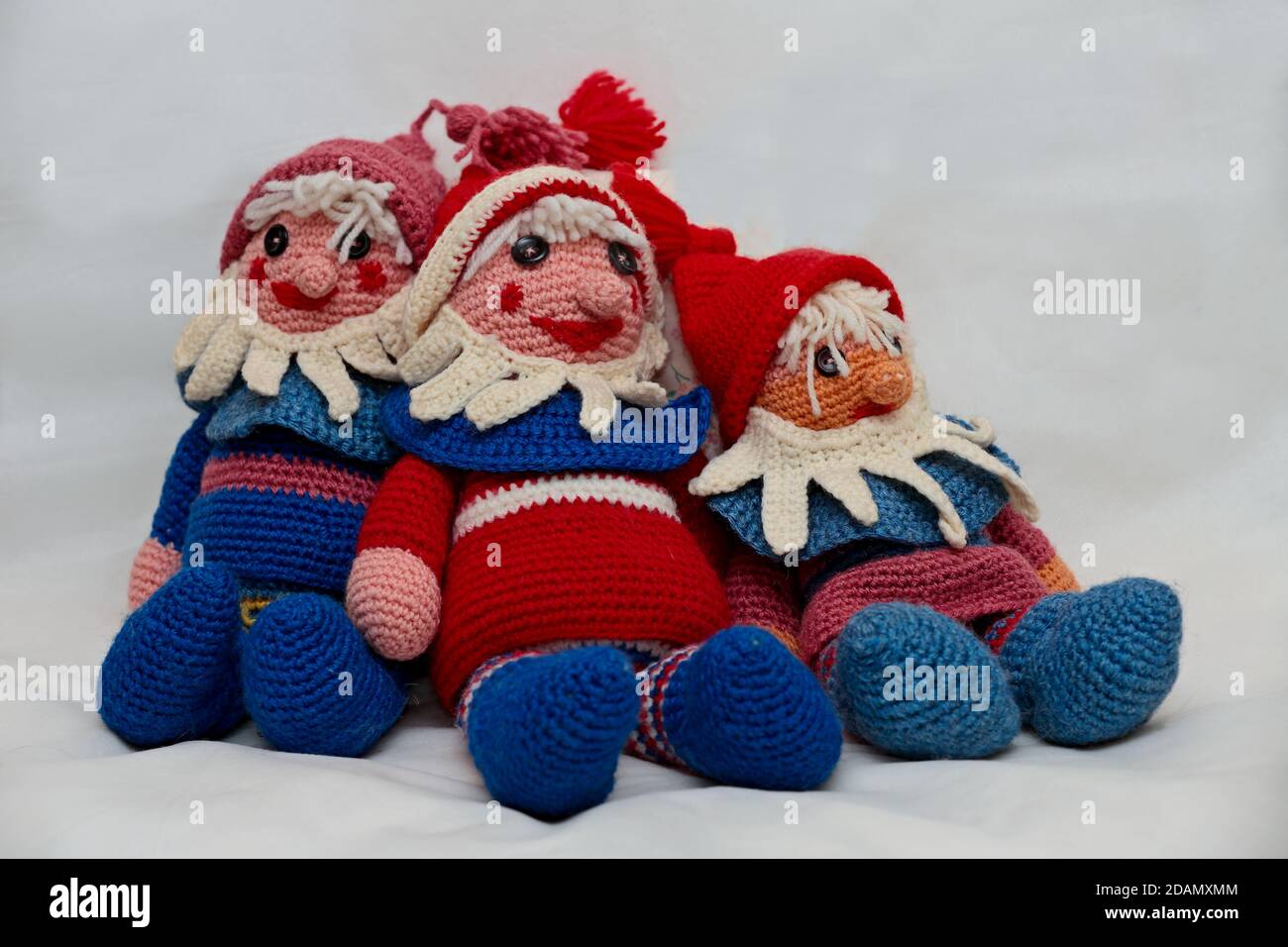 Three self made crocheted colorful gnomes with white background Stock ...