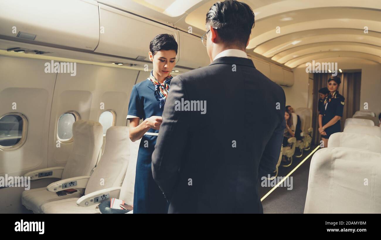 Flight attendant passenger welcome hi-res stock photography and images ...