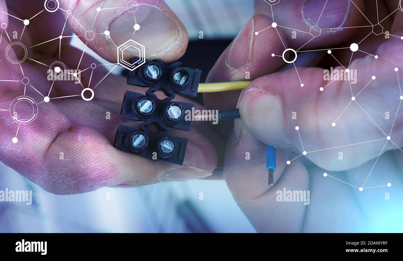 Hand putting a wire in a connector; light effect Stock Photo - Alamy