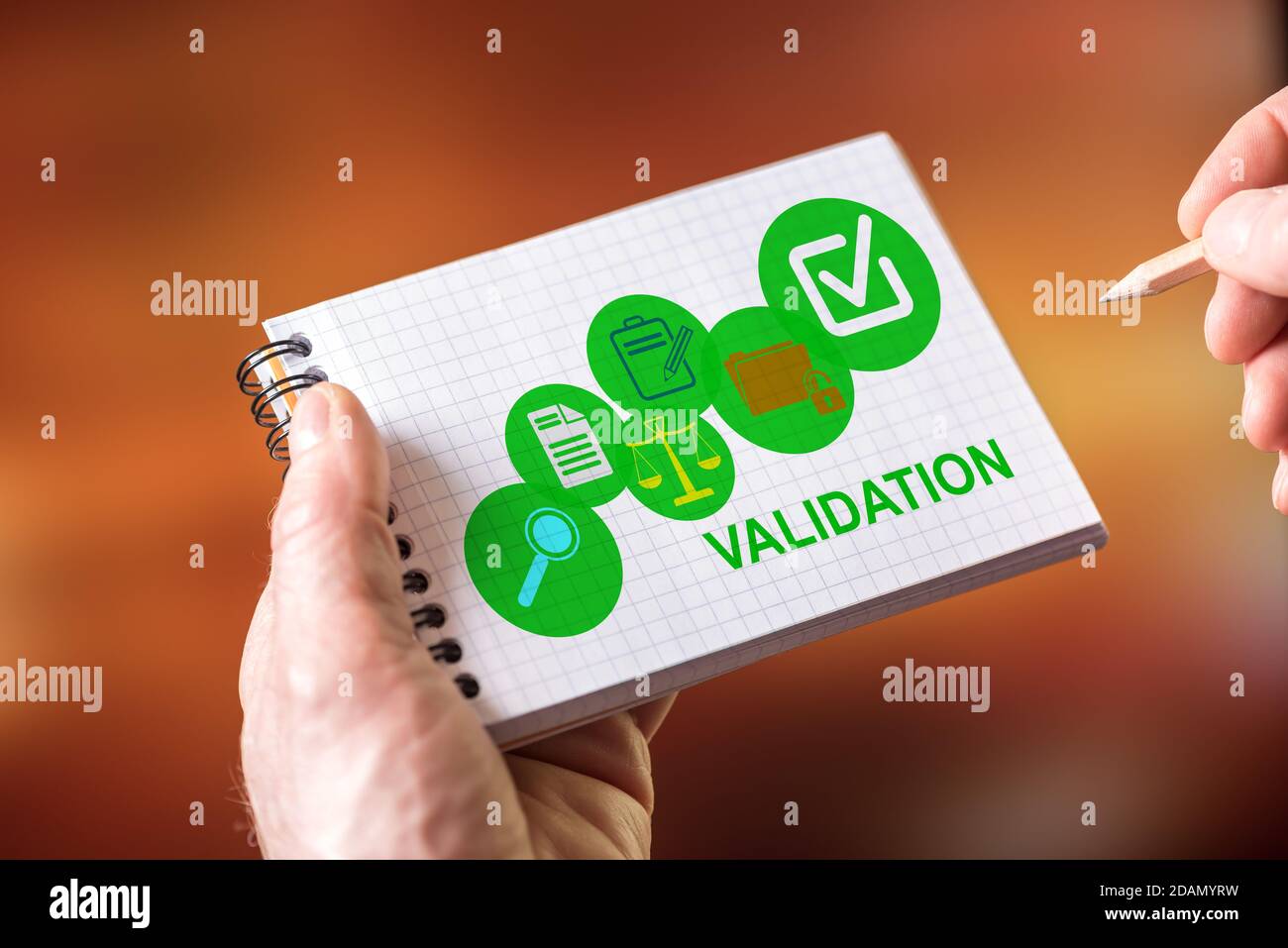 Hand drawing validation concept on a notepad Stock Photo - Alamy