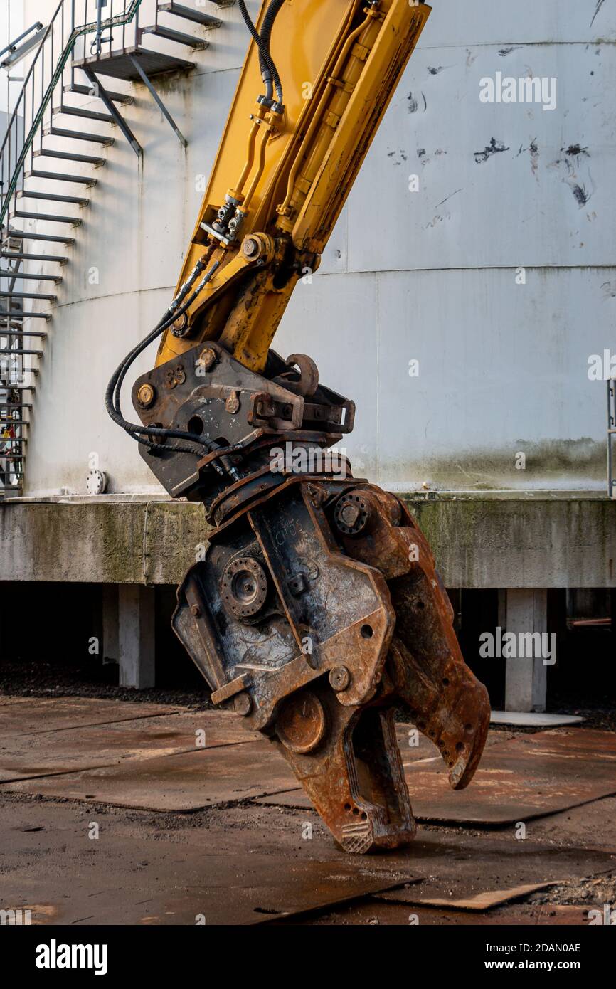 hydraulic shears on an excavator ready to start demolishing and cutting ...