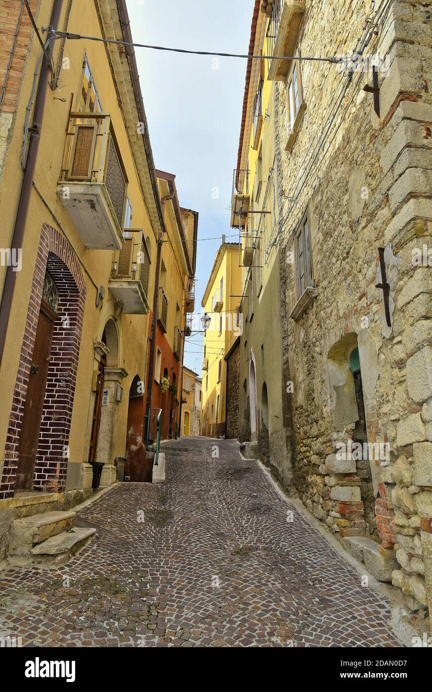 A narrow street among the old houses of Mirabello Sannitico, a medieval ...