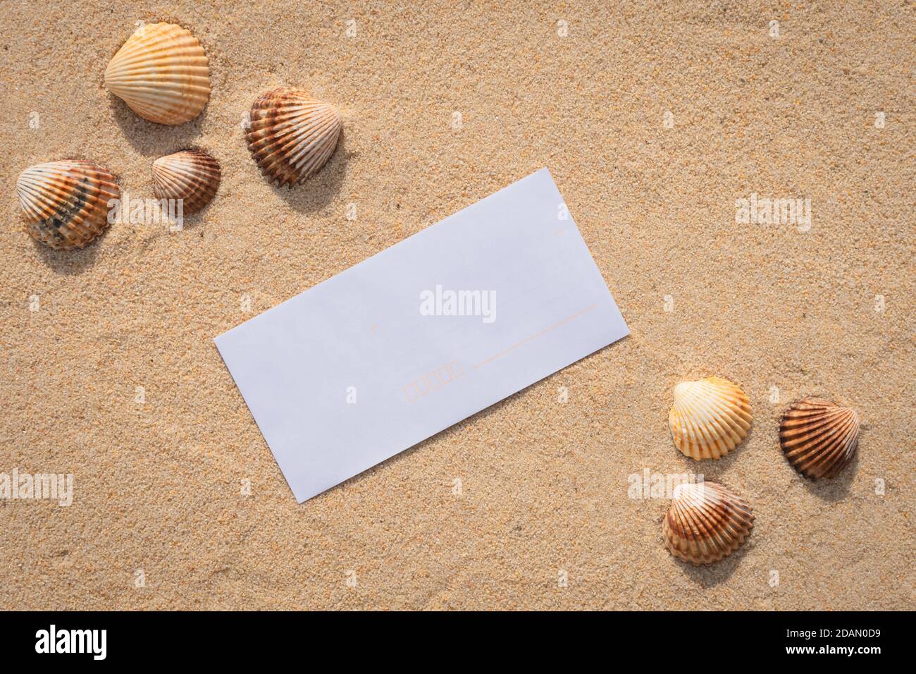 Background grains of sea sand, fine beach sand with envelope and pebble ...