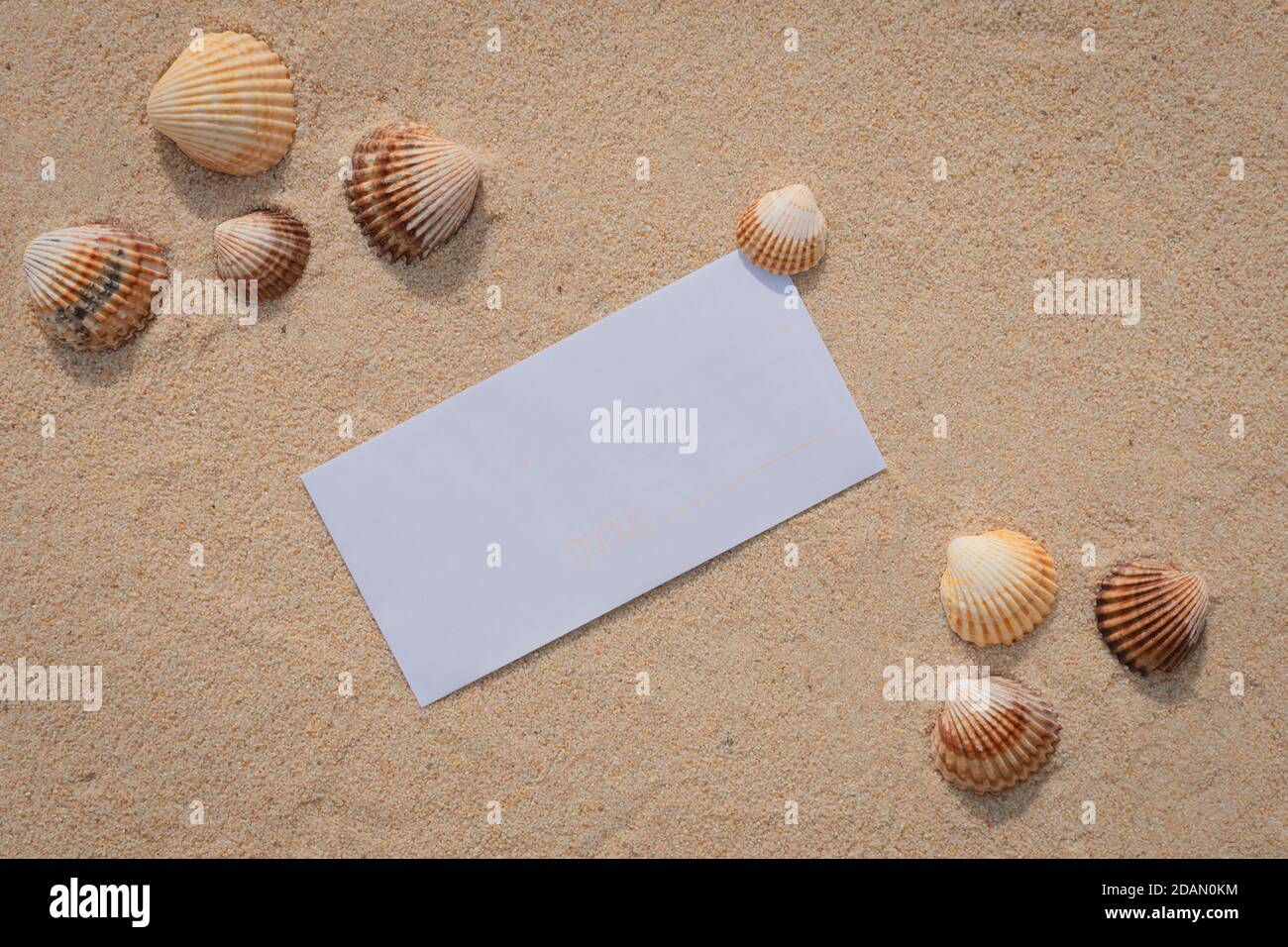 Background grains of sea sand, fine beach sand with envelope and pebble ...